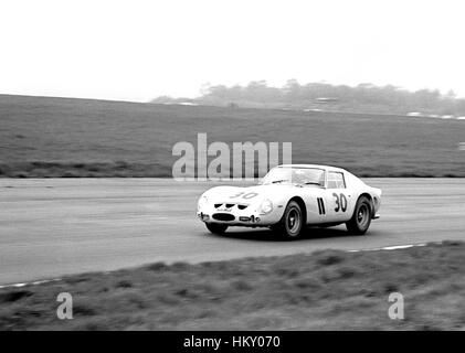 Race car driver Masten Gregory driving car 82, made by MT Harvey ...