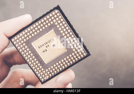 male hand holding microprocessor package - backside view Stock Photo ...