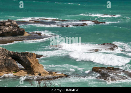 Limestone rock wave-cut platforms on a beach at Point Peron with algae ...