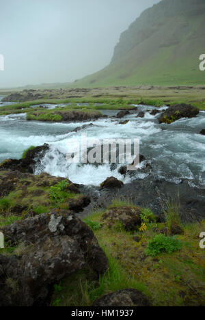 Fast moving stream and rapids of cold glacial water, Iceland Stock ...