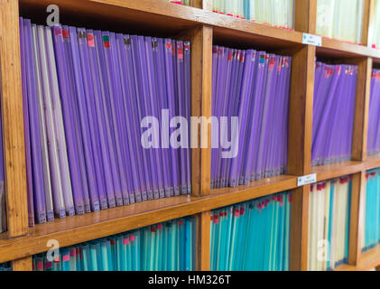 documents aligned on the shelf of a bookcase Stock Photo - Alamy