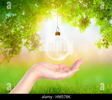 Human hand holding Transparent Christmas ball Stock Photo - Alamy