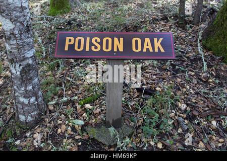 A sign warning of poison oak Stock Photo - Alamy