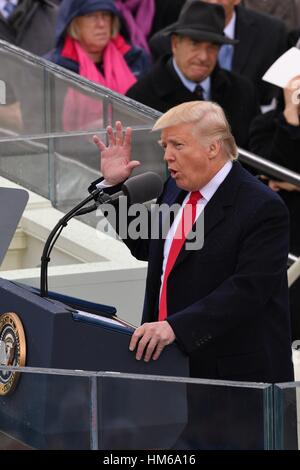 President Donald Trump gestures after signing an executive order ...