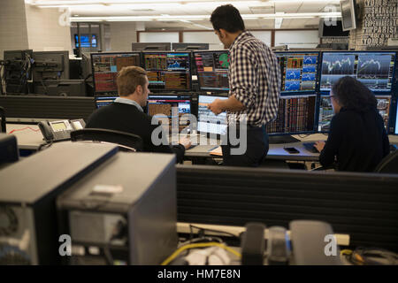 Stock traders working in office Stock Photo - Alamy
