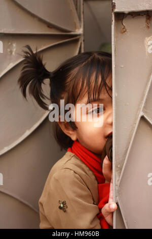 scared beautiful girl hiding behind door at home Stock Photo: 138664093 ...