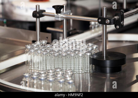 Ampoule filling and sealing machine Stock Photo - Alamy