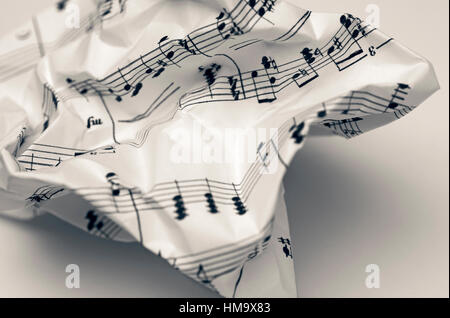 crumpled paper sheet of music notes on the floor, closeup,for music ...