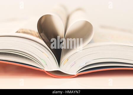 Open book with pages forming heart shape Stock Photo - Alamy