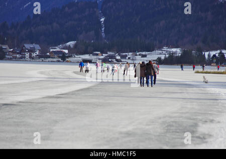 WEISSENSEE,AT - DECEMBER,24 2012 - People skate on the iced surface of ...
