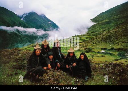 Group of Layap women wearing pointy hats, Jari-la, Bhutan Stock Photo ...