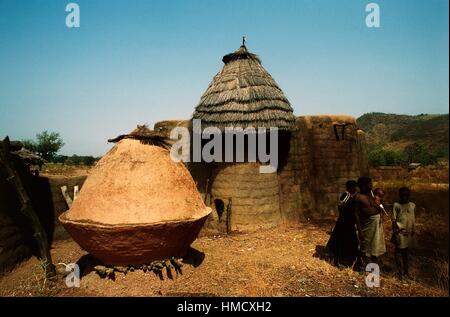 Tata, fortress house, and circular huts in a village, Togo Stock Photo ...