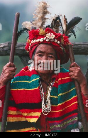 Igorot woman wearing traditional clothing and feather headdress, Baguio ...
