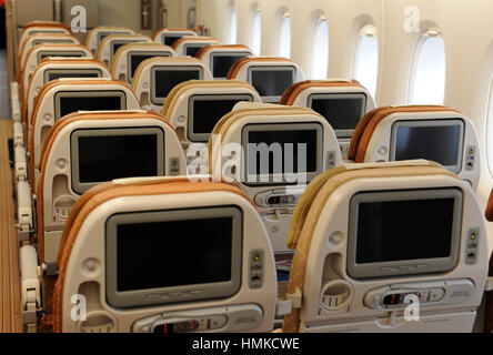 IFE screen in the seat-back of economy-class cabin seat with emergency ...