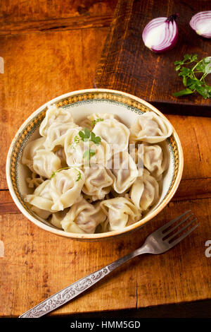Traditional Chinese pork and mushroom dumplings Jiaozi on plate with ...