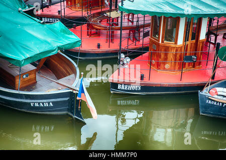 A scenic view of small boats docked at a harbor seen on a sunny day ...