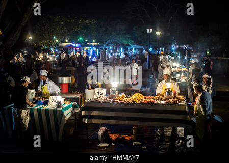 Chefs prepare dishes during the Night food market at Forodhani Gardens ...