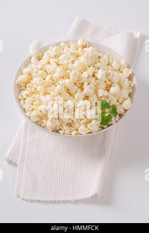 Fresh popcorn on white plate with clipping path. Concept of food Stock ...