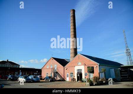 A tall industrial chimney above Victorian era factories Stock Photo - Alamy