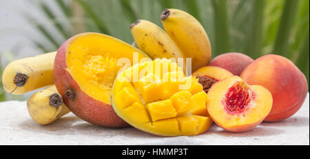 tropical fruits mango, peach and banana Stock Photo - Alamy