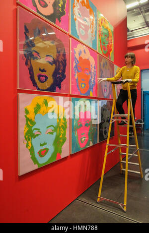 Project curator Catherine Daunt checks 10 "Marilyn" screenprints by ...