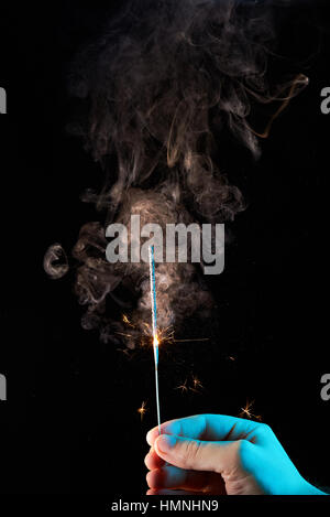 Sparkler isolated on black Stock Photo - Alamy