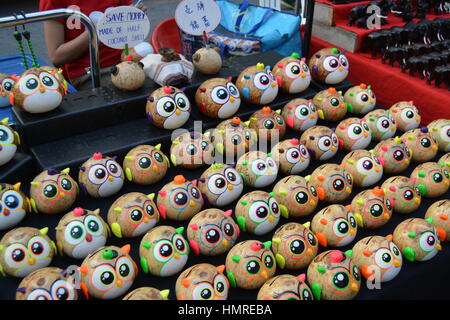 Owl toys made of coconut shell Stock Photo - Alamy