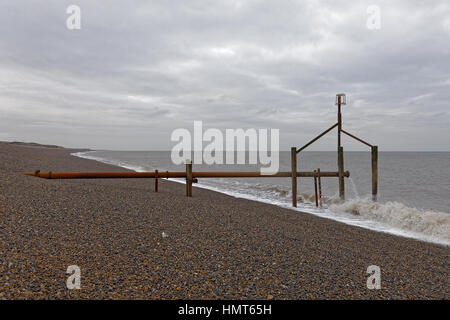 Water Piped Across a Beach Flowing into the Sea Under Dilapidated ...
