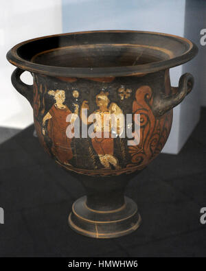 Campanian red figure krater depicting a warrior with helmet, shield, cuirass and spear looking a ...