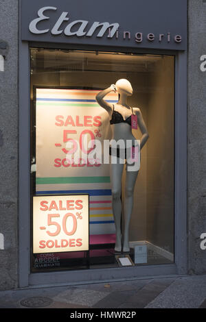A shop front sign announces discounts on the first day of the winter ...