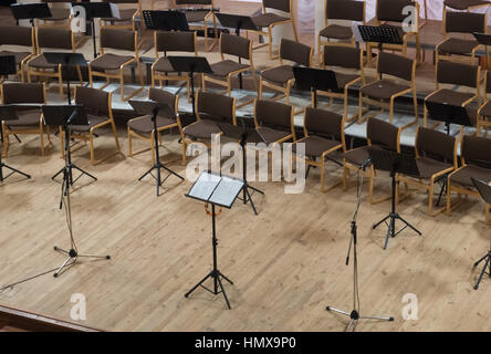 Empty stage with chairs and music stands before the concert. Arranged ...