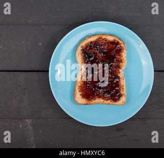 Typical Dutch apple syrup called Appelstroop on bread on wooden ...