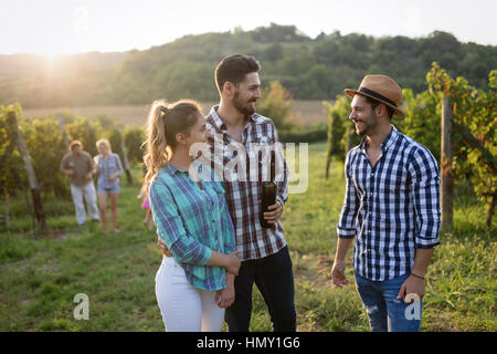 Wine grower and people in vineyard Stock Photo - Alamy