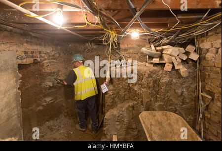 A basement extension is dug out inside a residential terrace house in ...