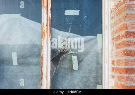 Accident cracked damaged broken house window glass Stock Photo - Alamy