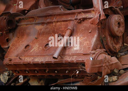 Rusted car engine inside an equally rusty car sitting on the hiking ...