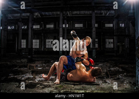 Two agressive box fighters having sparring outdoor. Mixed media Stock ...