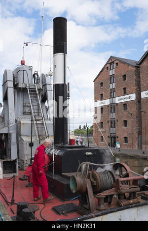Volunteers working on a historic steam dredger in Gloucester docks ...
