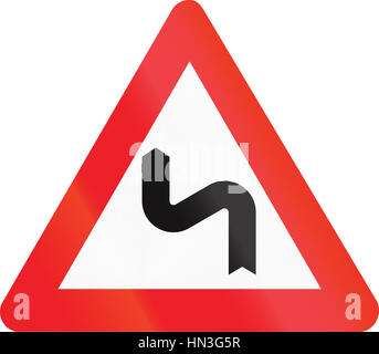 Double bend first to left road sign on white background Stock Photo - Alamy
