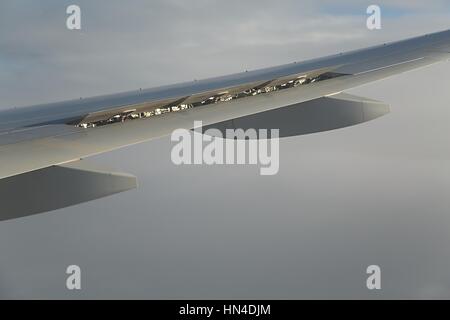 Aircraft wing wind with spoilers Stock Photo - Alamy