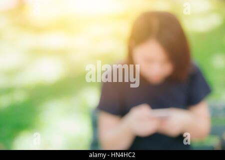 Closeup hand of Asian woman teen laying smart phone in the park Stock ...
