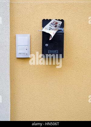 Junk mail and advertising on houses letter boxes Stock Photo - Alamy