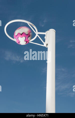 Netball going through the goal post Stock Photo - Alamy