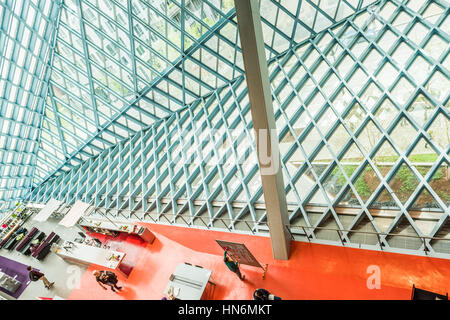 Interior view of Seattle Central Library with sloped glass roof ...