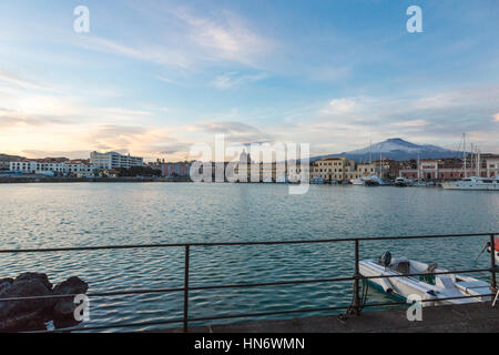Skyline of Catania and its harbor with snowy volcano Etna in Stock ...