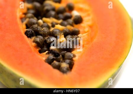 Papaya fruit cut open Stock Photo - Alamy