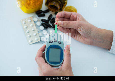 Close-up Of A Man's Hand Testing High Blood Sugar With Glucometer Stock ...