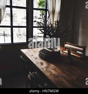 Chair with vintage typewriter and flowers in garden on spring day Stock ...