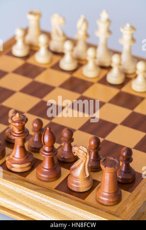 Chess pieces in starting position on a wooden oak Board Stock Photo - Alamy