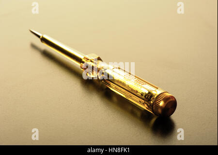 glowing yellow electrical tester screwdriver Stock Photo - Alamy